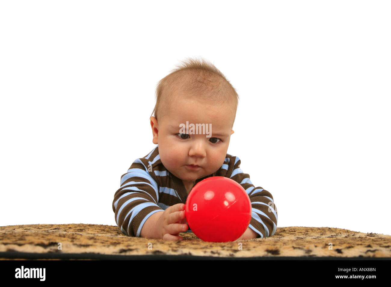 portrait of a baby with a red ball Stock Photo - Alamy