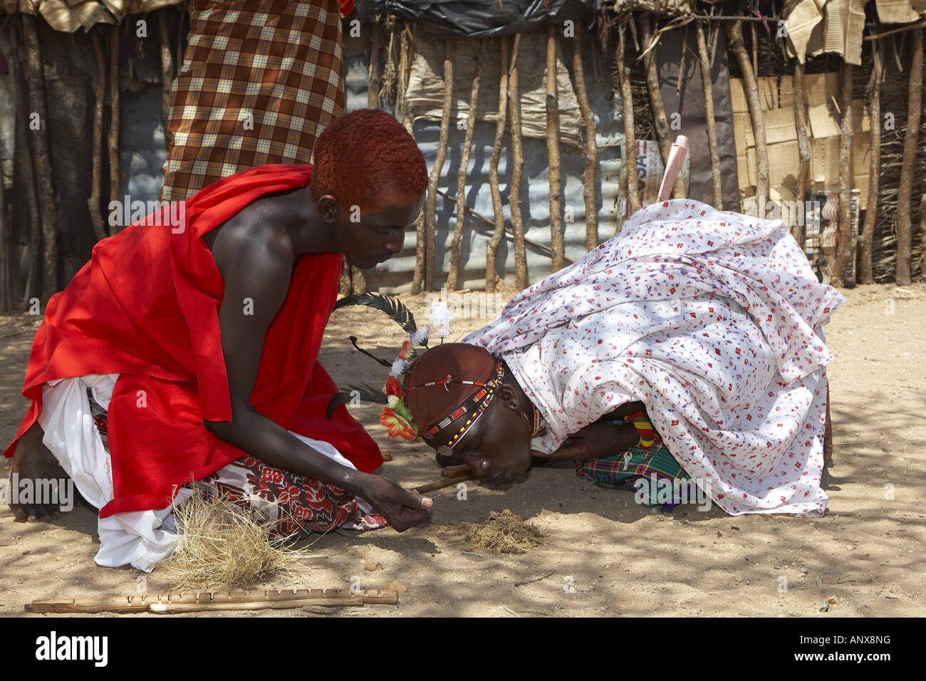 two men making fire in a traditional way, Kenya, Samburu Gebiet, Isiolo ...