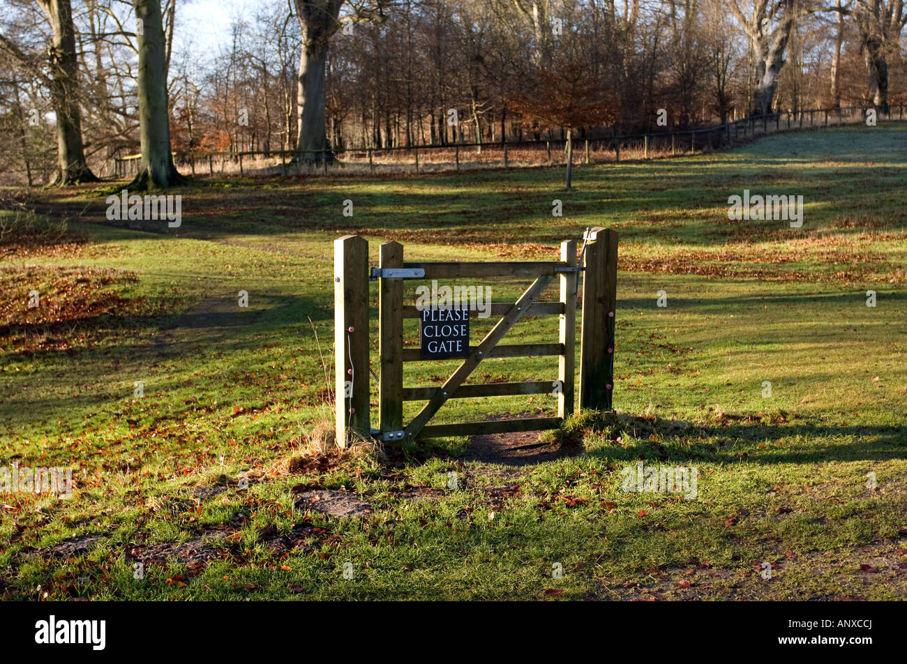 Please Close Gate sign on gateway with no adjoining fences, in the ...
