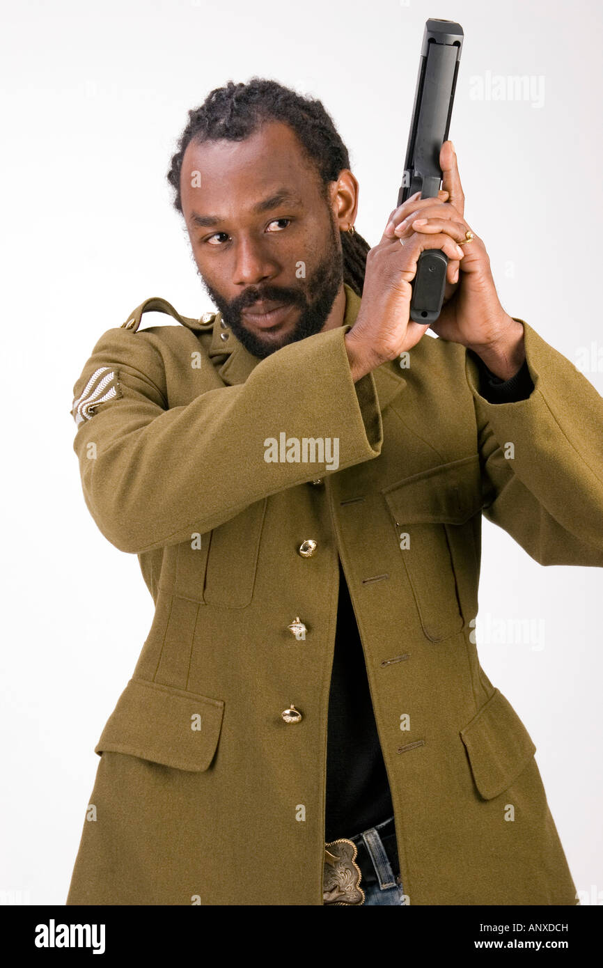 A Black man in a Army jacket with a gun Stock Photo - Alamy