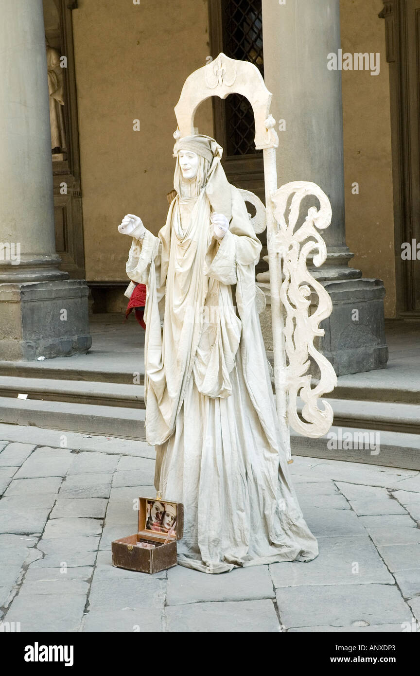 A vertical picture of a living statue in the Uffizi Courtyard Stock ...