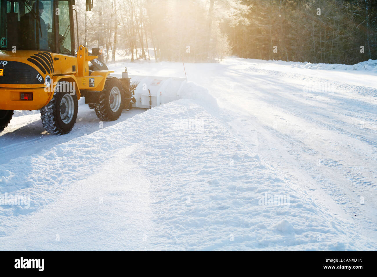 Small snow plow in action Stock Photo - Alamy