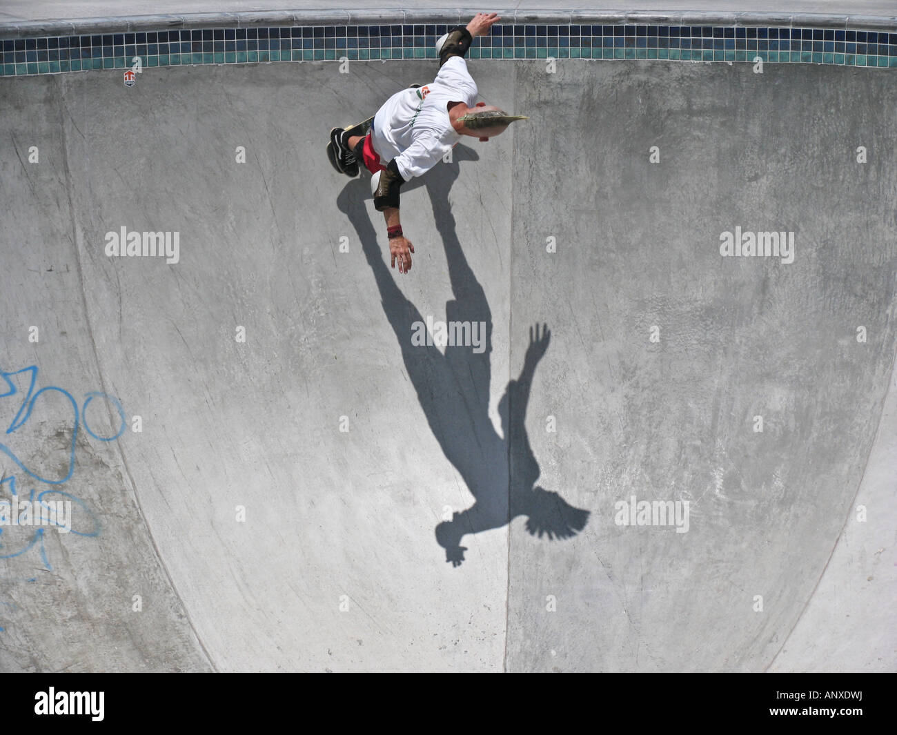 Punk skateboarder casts a shadow Stock Photo - Alamy