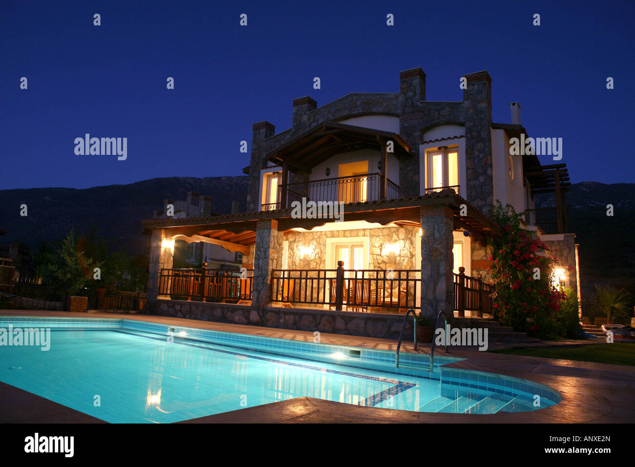 Night shot of private holiday villa in Turkey with gardens and ...