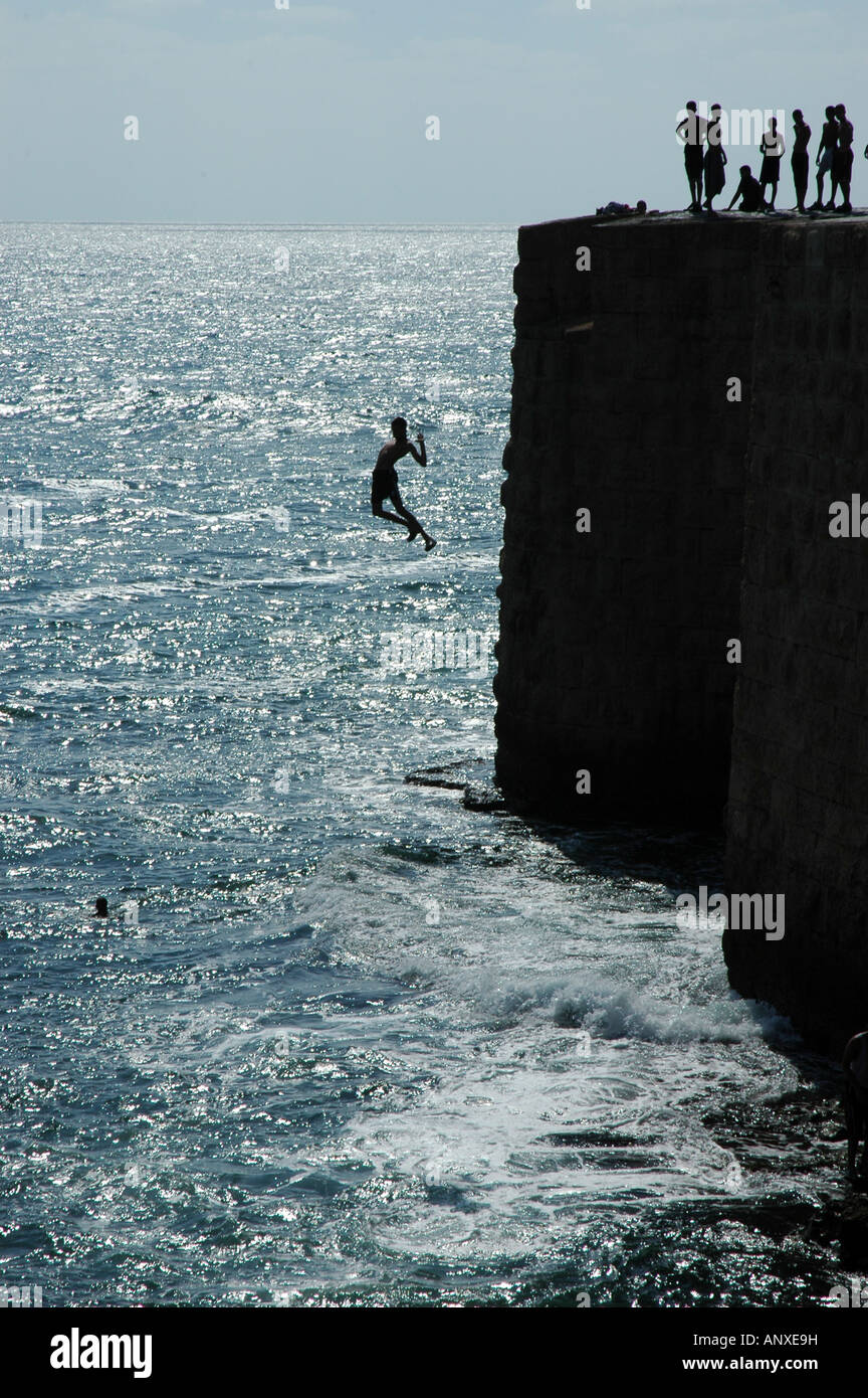 Child jumping off wall hi-res stock photography and images - Alamy