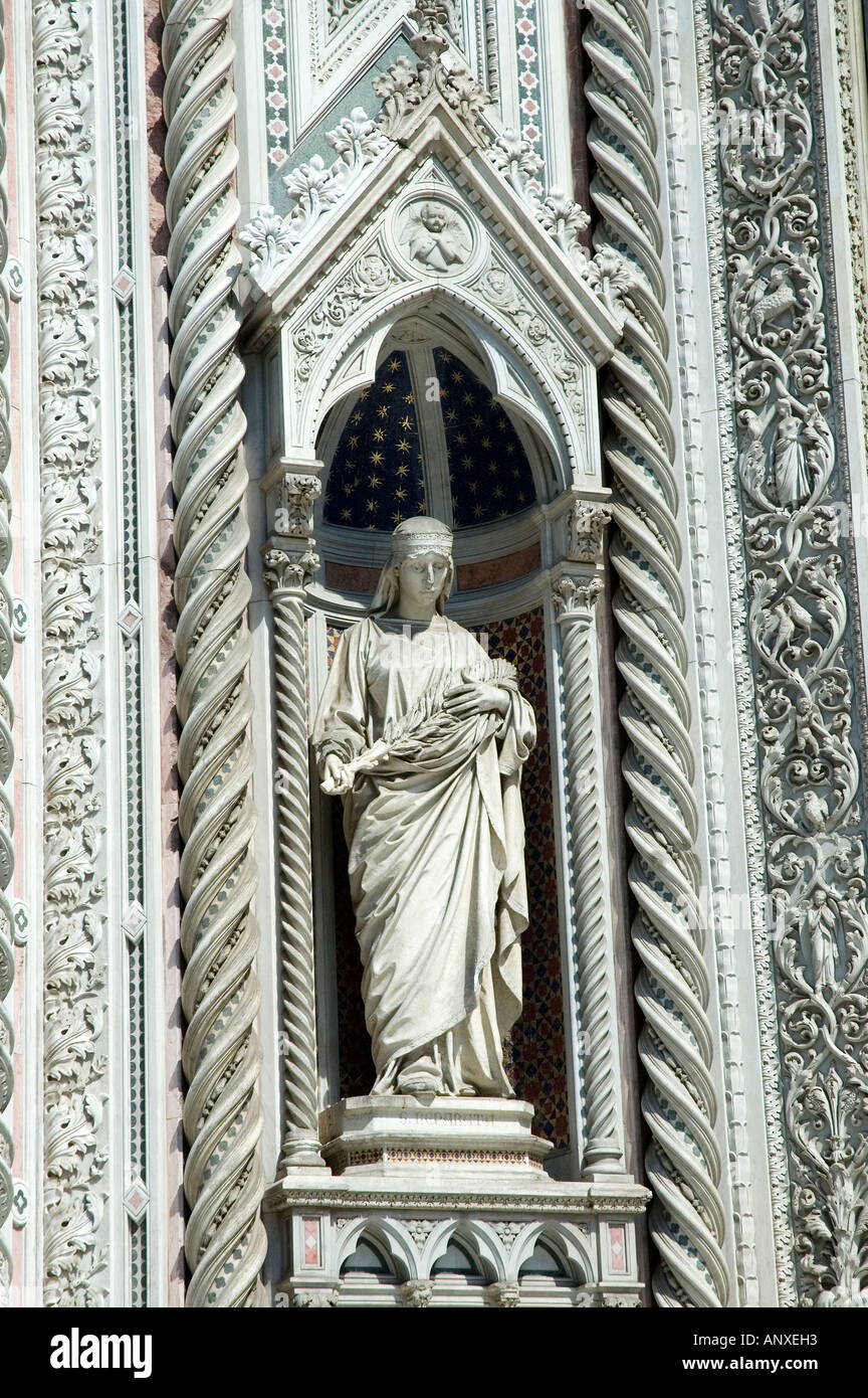 A vertical picture of a statue on the facade of the Cathedral in ...
