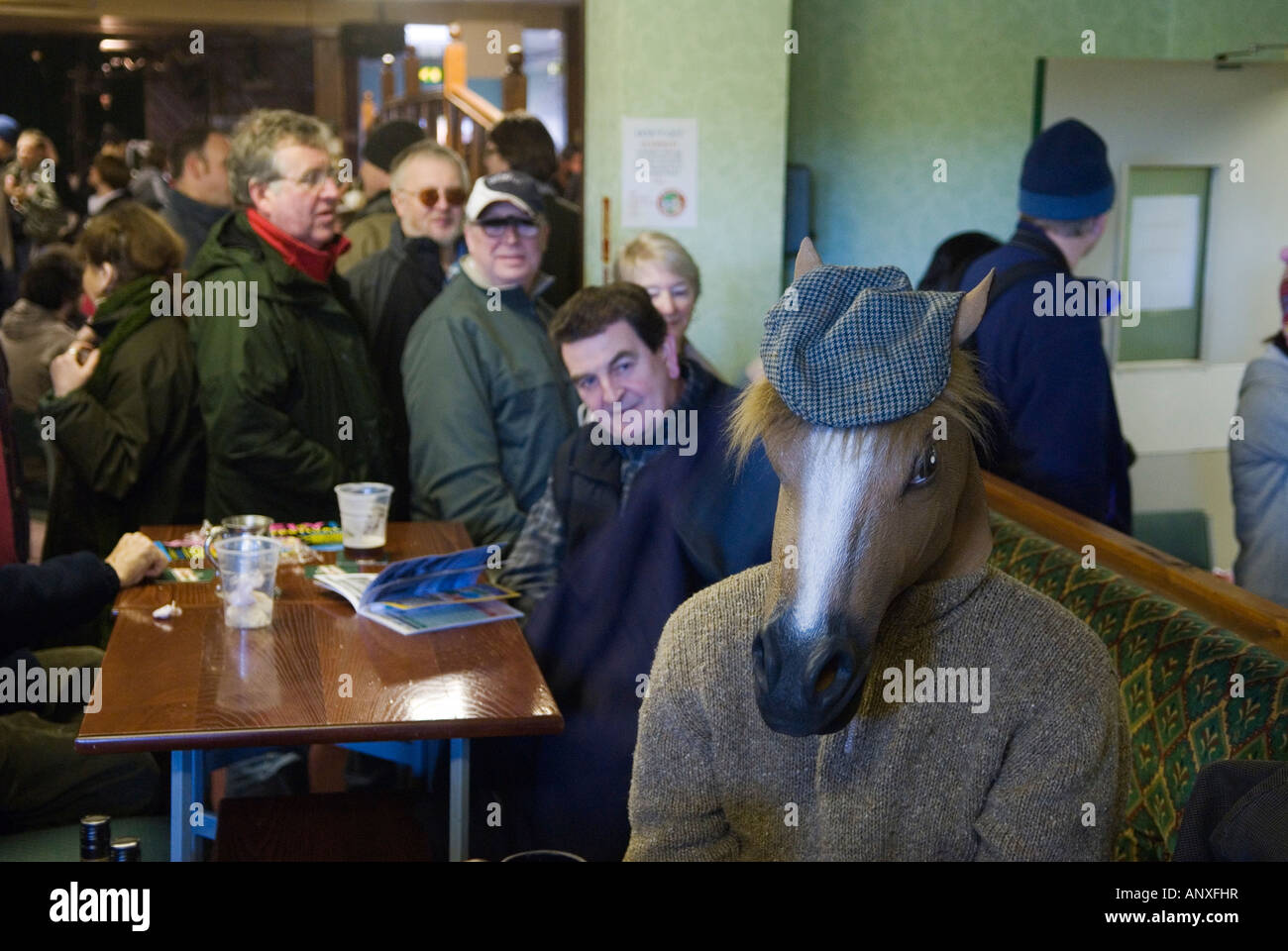 Adults dressing up Man in horse mask a horses head. Whittlesea ...