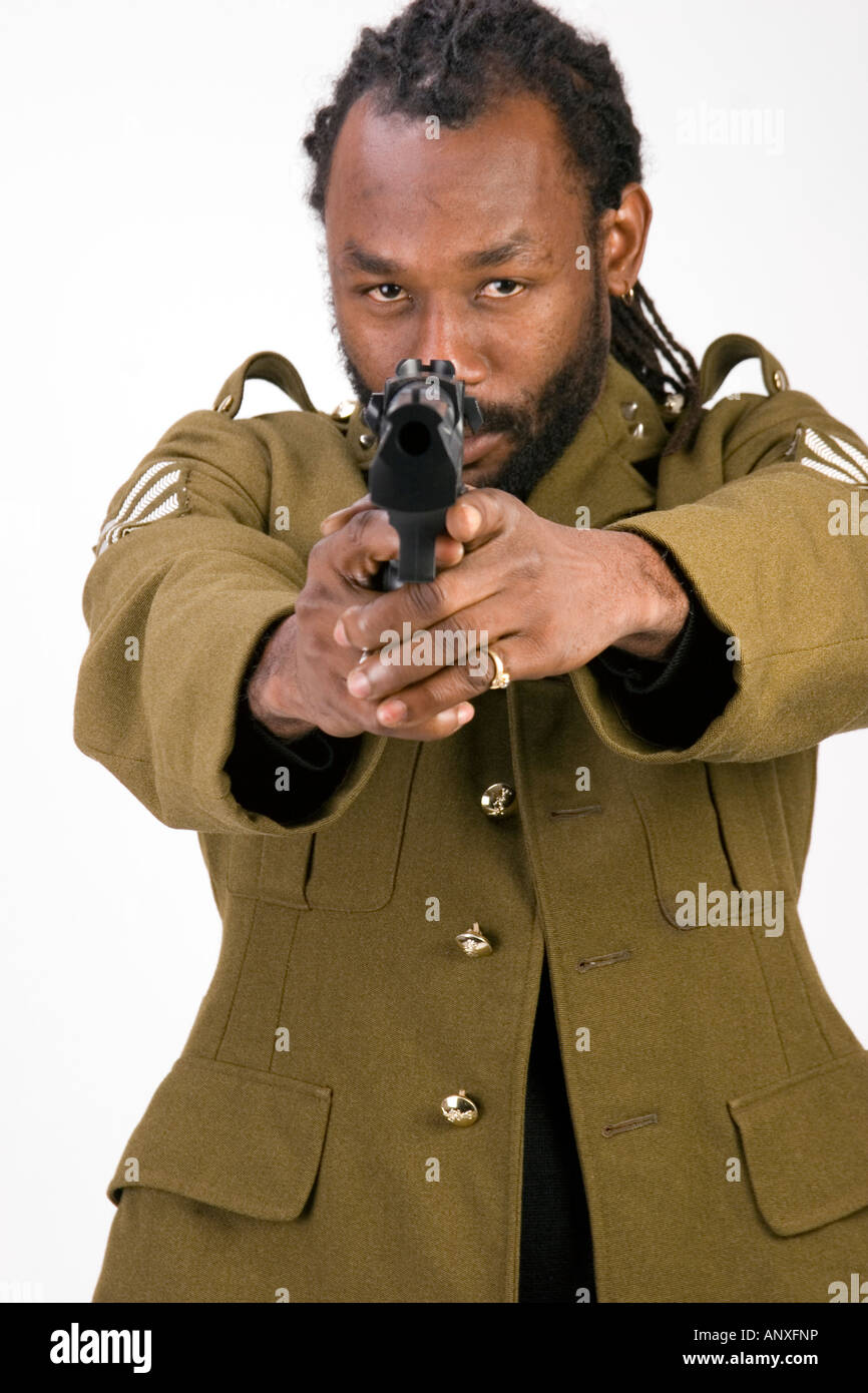 A Black man in a Army jacket with a gun Stock Photo - Alamy