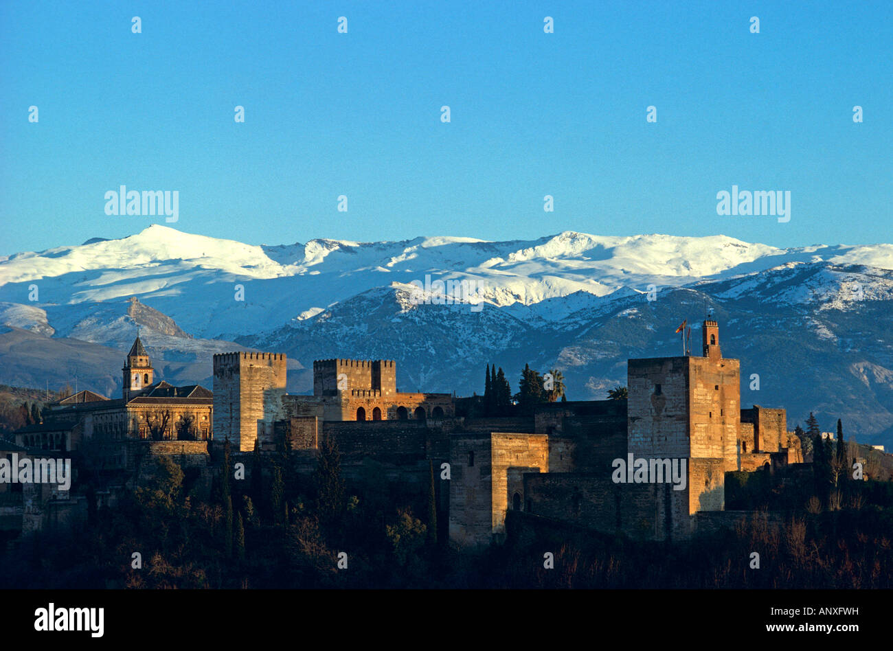 Spain, Andalusia, Granada. The Alhambra splendidly lit by a winter ...