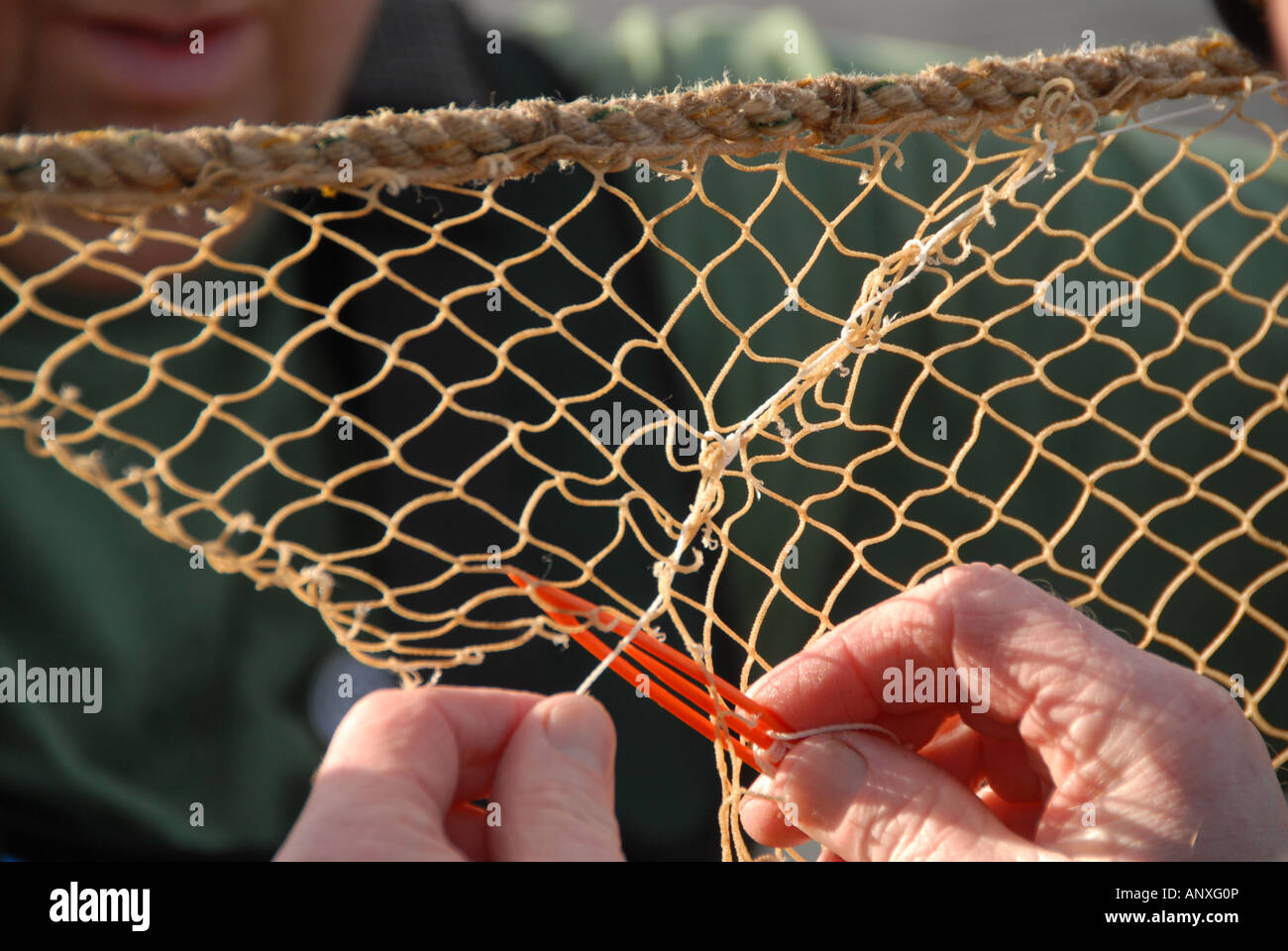 Fishing Net Repairs Stock Photo - Alamy