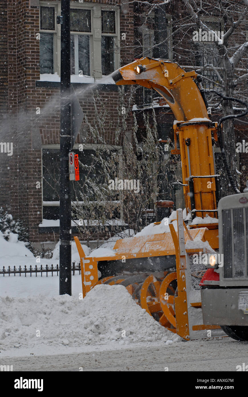 Snow blower cleaning street in winter Stock Photo - Alamy