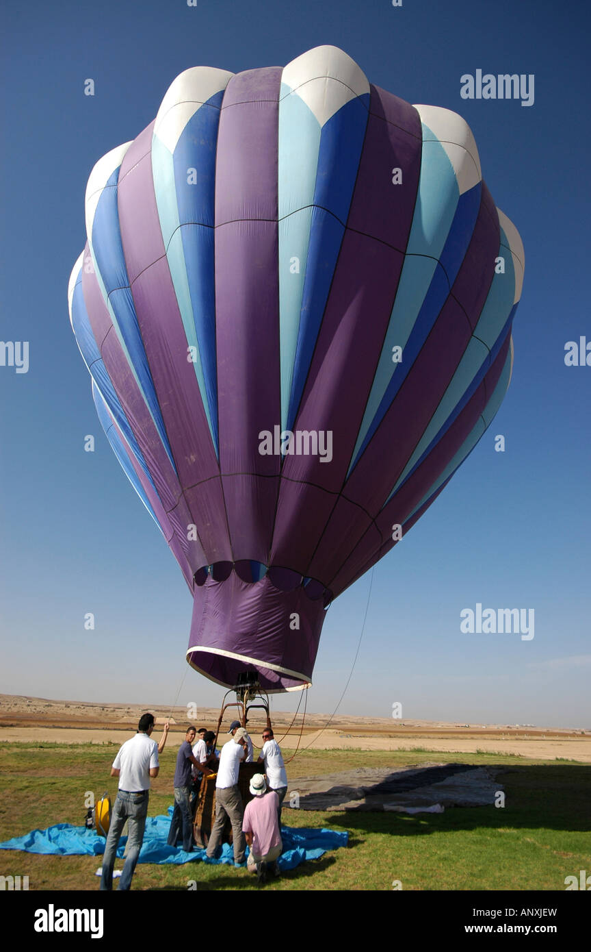 Ground crew preparing a hot air balloon before takeoff Stock Photo - Alamy