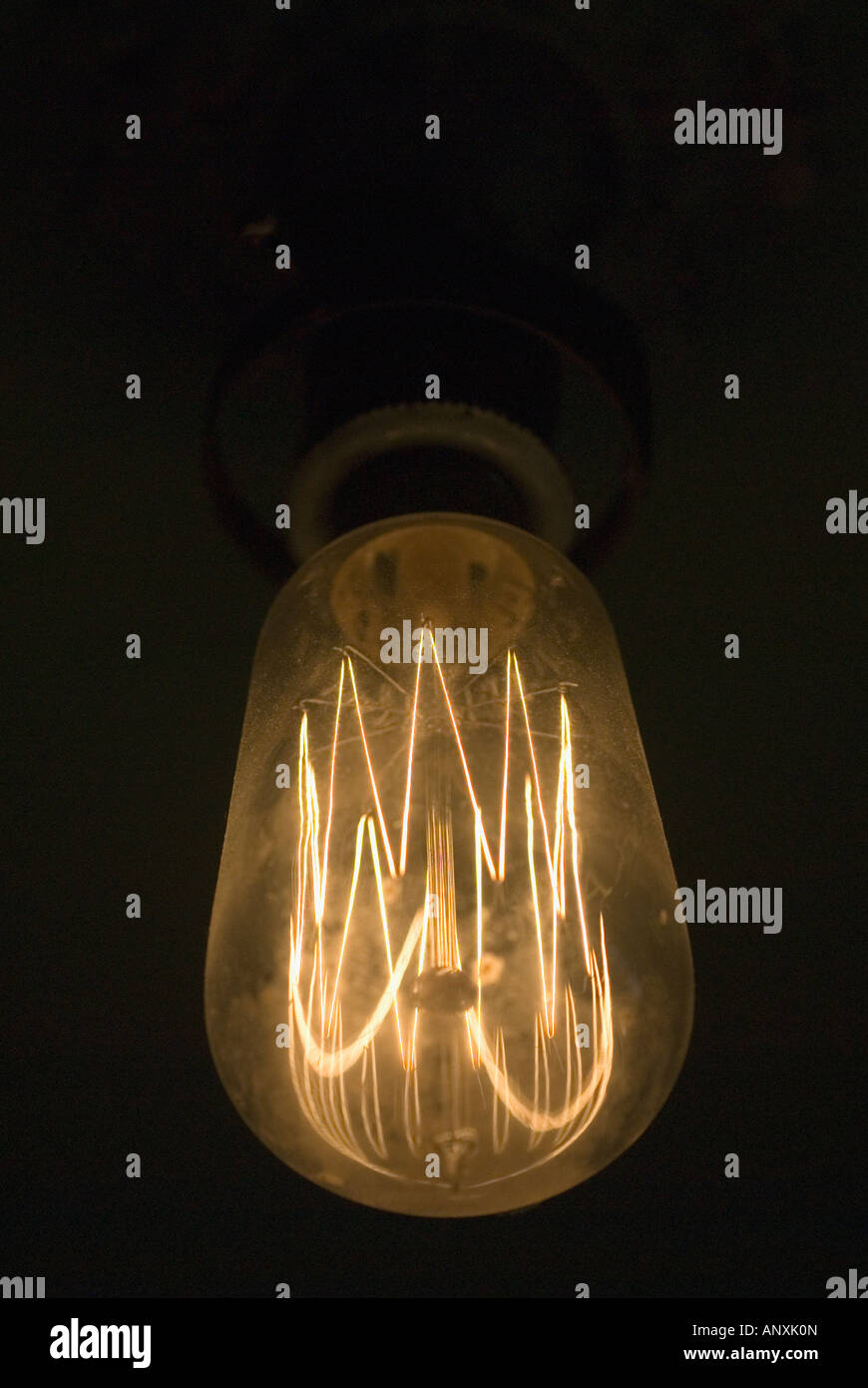 Nostalgic light bulb with glowing filament Stock Photo - Alamy