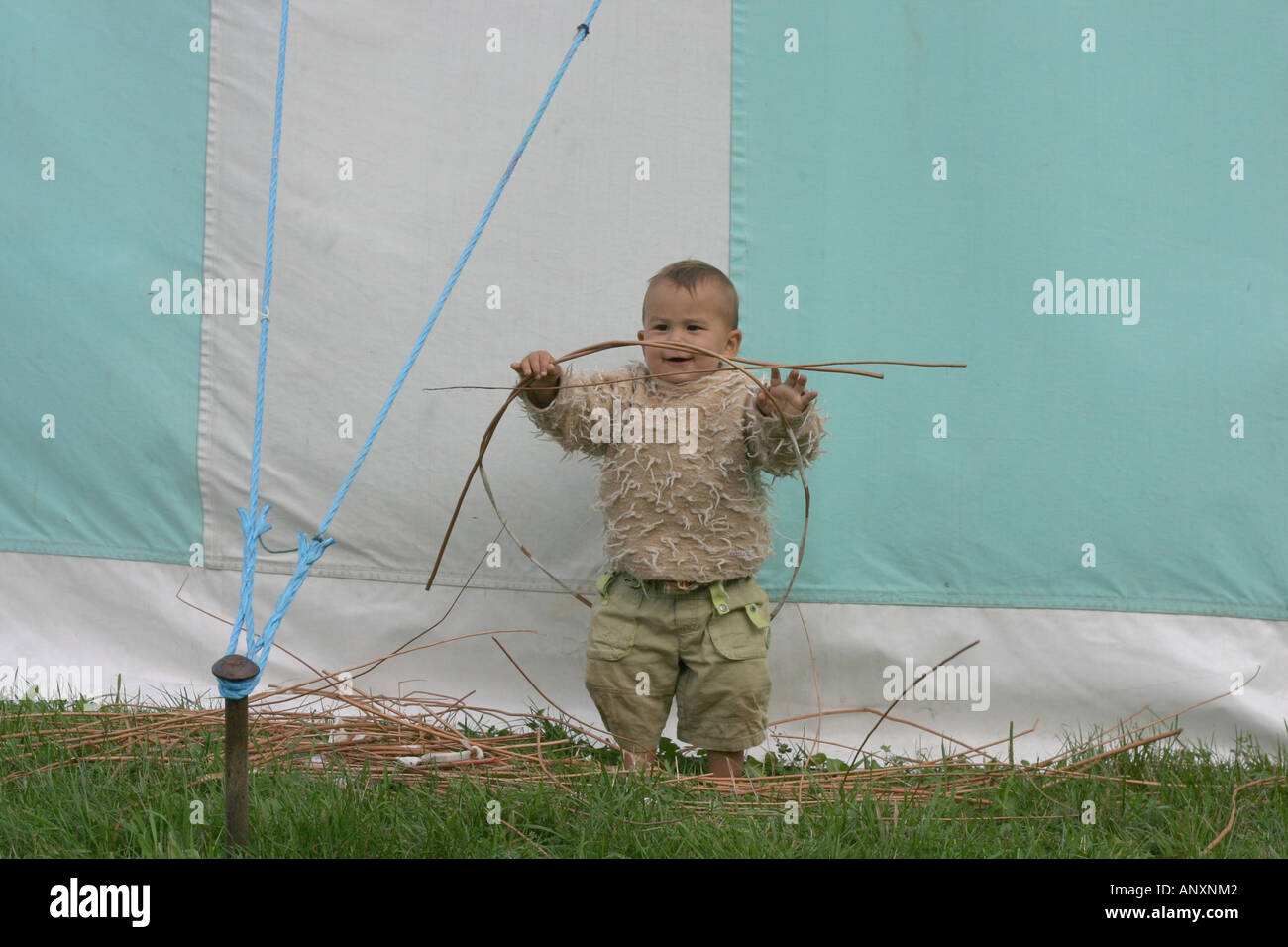 toddler playing with willow branches Stock Photo - Alamy