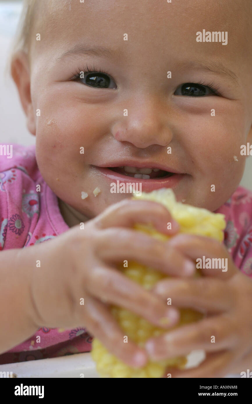 Baby eating Corn Stock Photo - Alamy