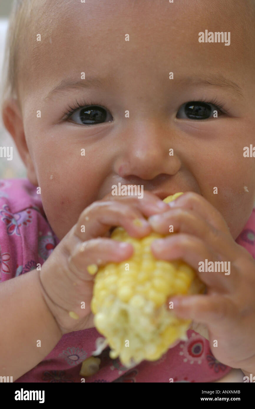 Baby eating Corn Stock Photo - Alamy