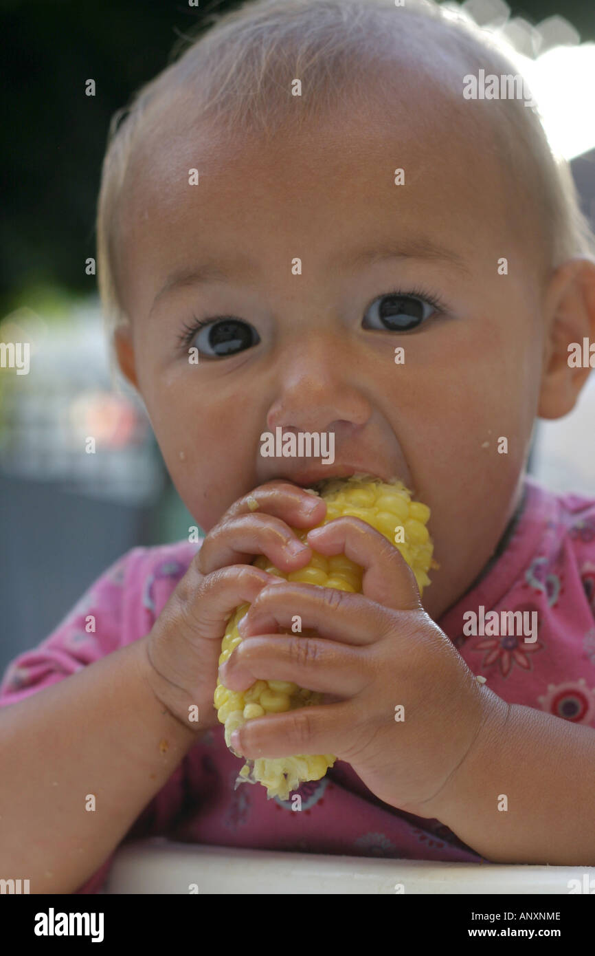 Baby eating Corn Stock Photo - Alamy