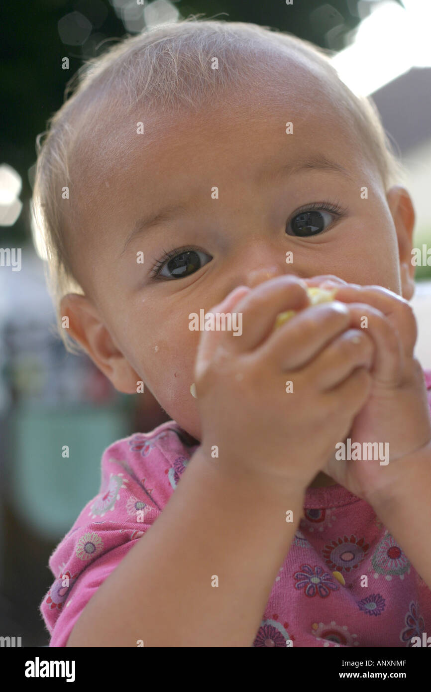 Baby eating Corn Stock Photo - Alamy