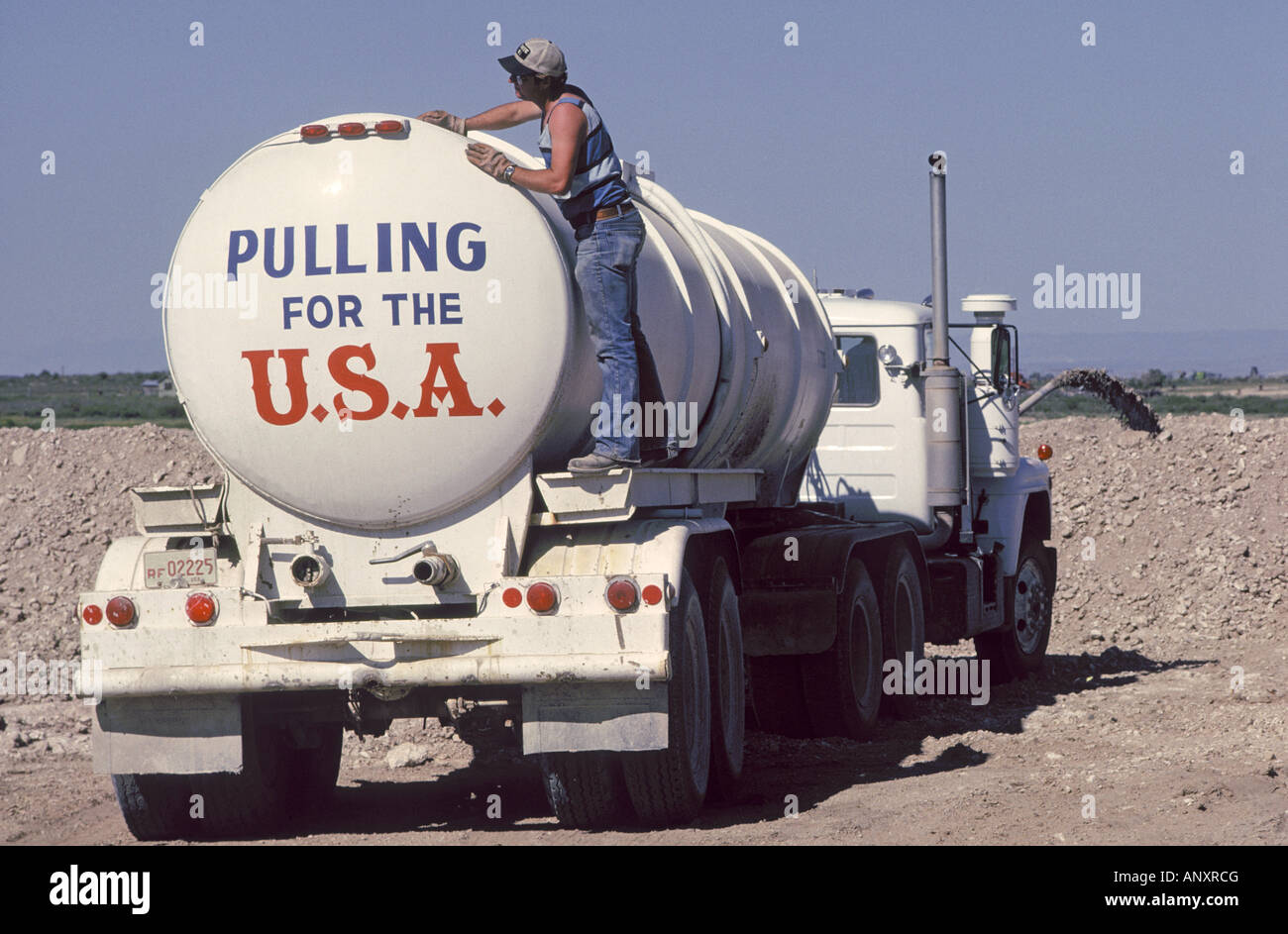 An oil truck hauls crude oil from a drilling rig in New Mexico to a ...