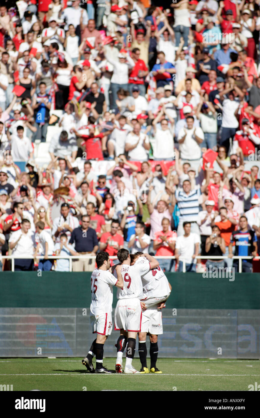 Sevilla FC players hugging to celebrate a Puerta's goal Stock Photo - Alamy