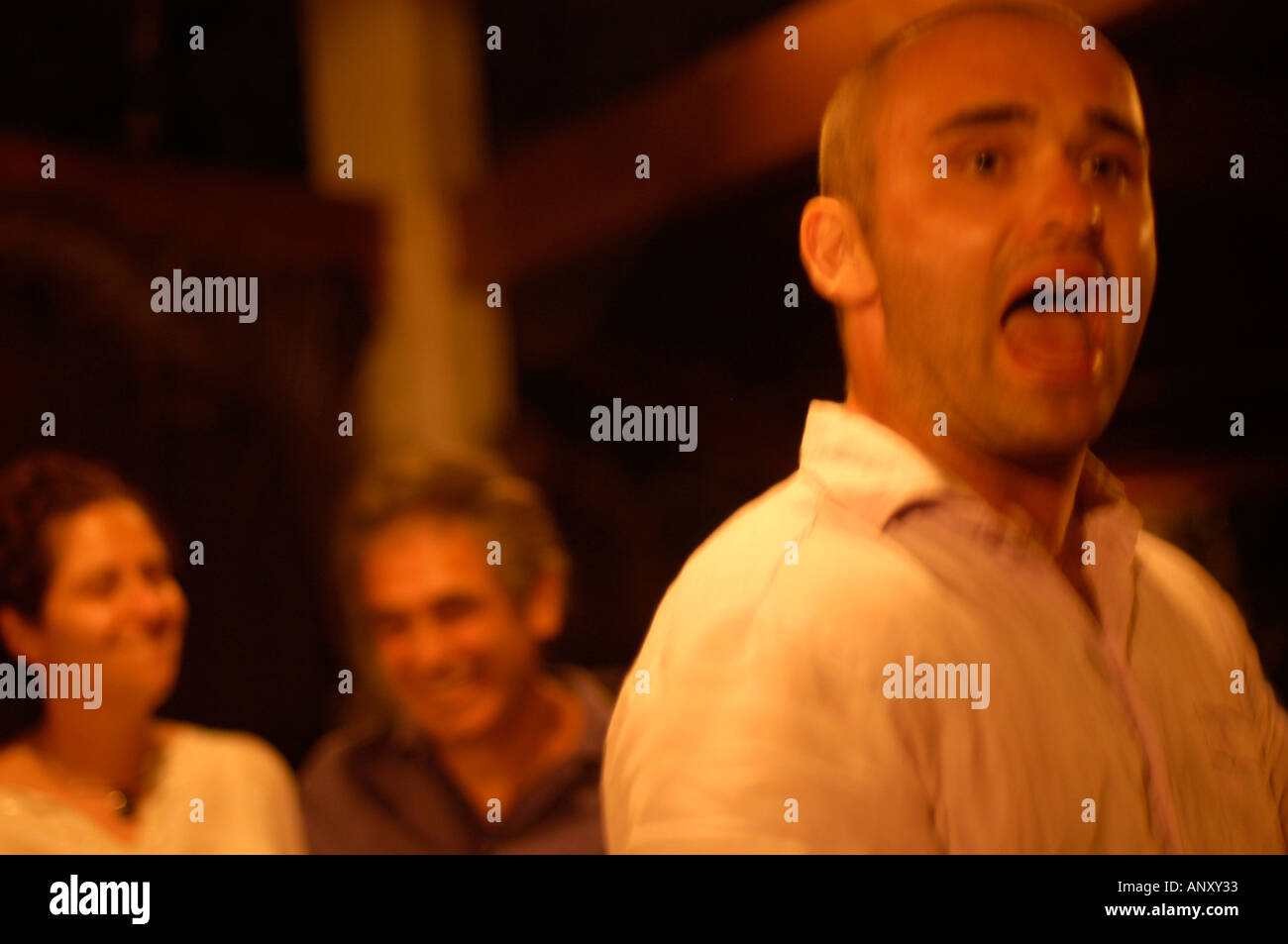 Man singing vocal people watching looking talking fun enjoyment hi-res ...