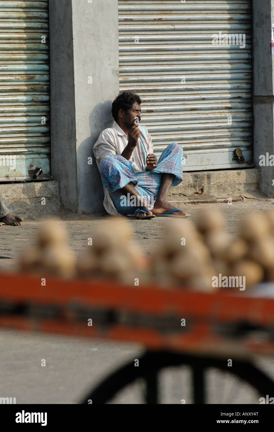 Man rests against a wall Stock Photo - Alamy