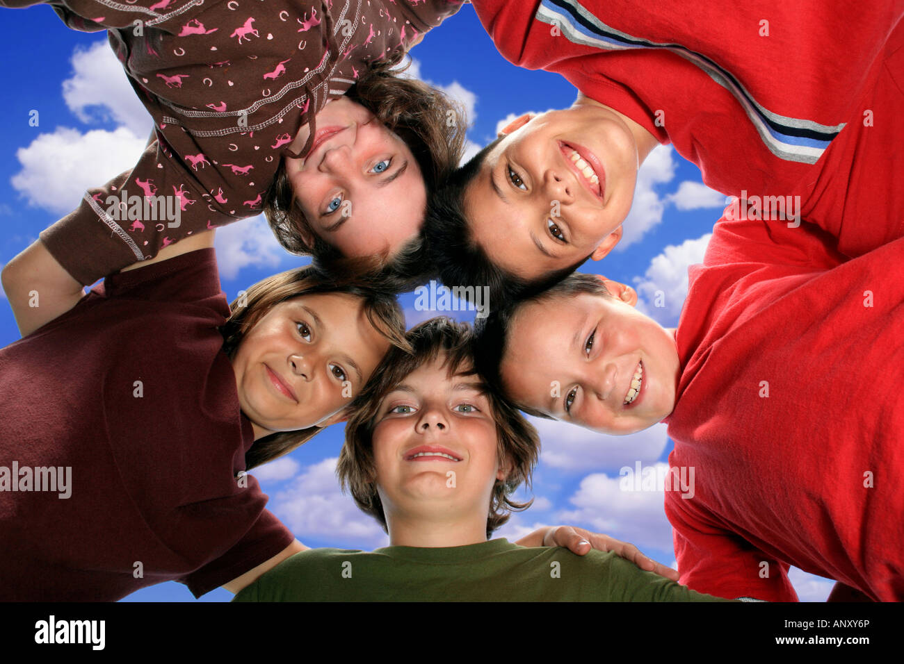 Young Kids Huddled Together Stock Photo - Alamy