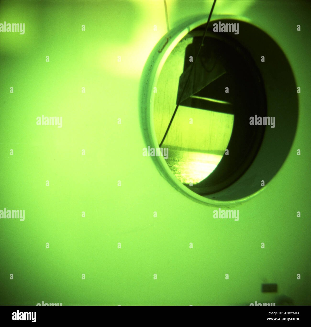 color cross processed toy camera photograph of porthole on ferryboat ...