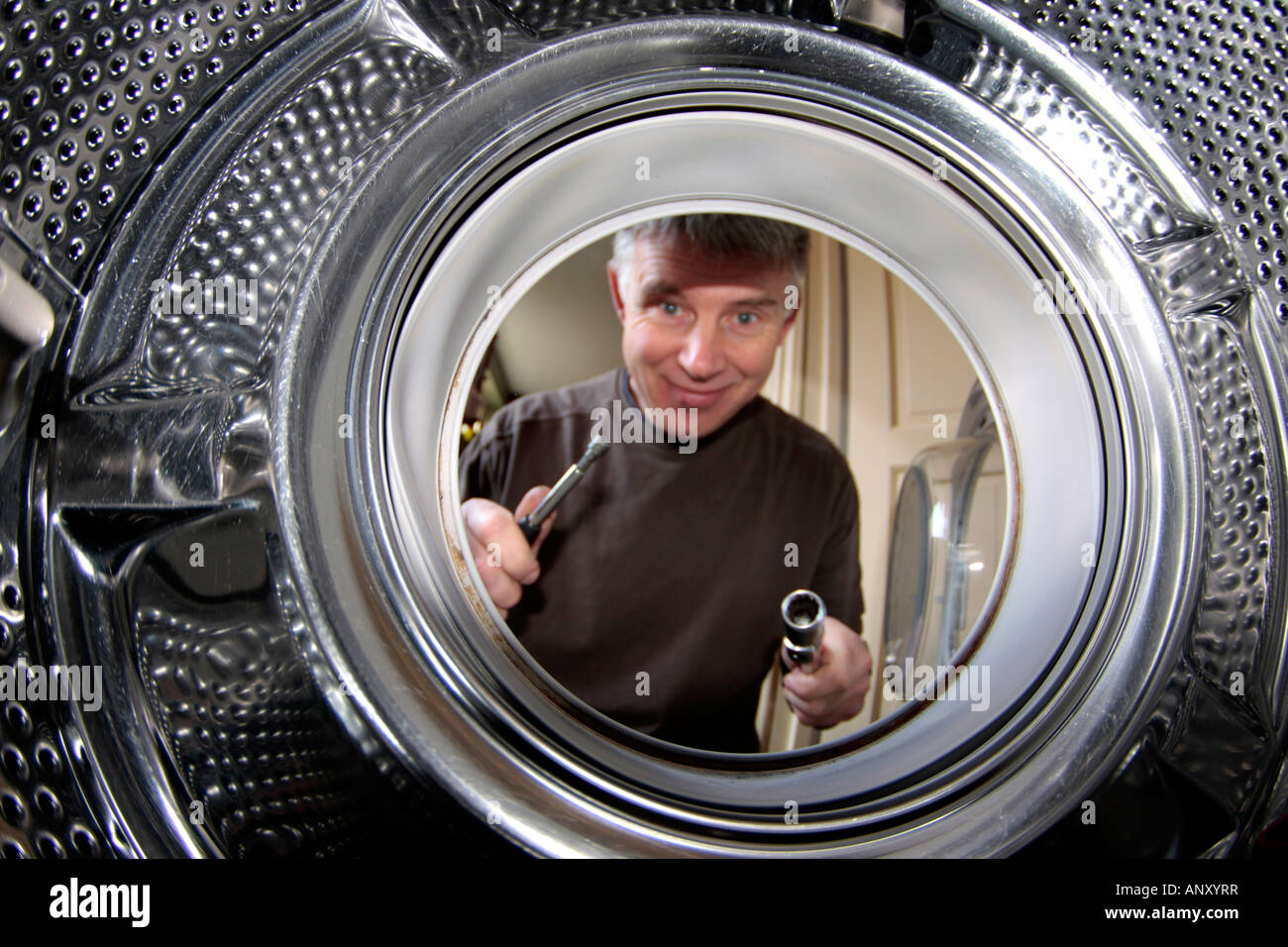 Washing machine repair hi-res stock photography and images - Alamy
