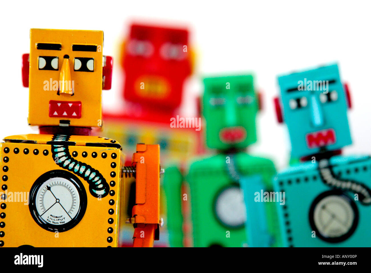 4 Chinese manufactured tinplate clockwork toy robots looking into ...