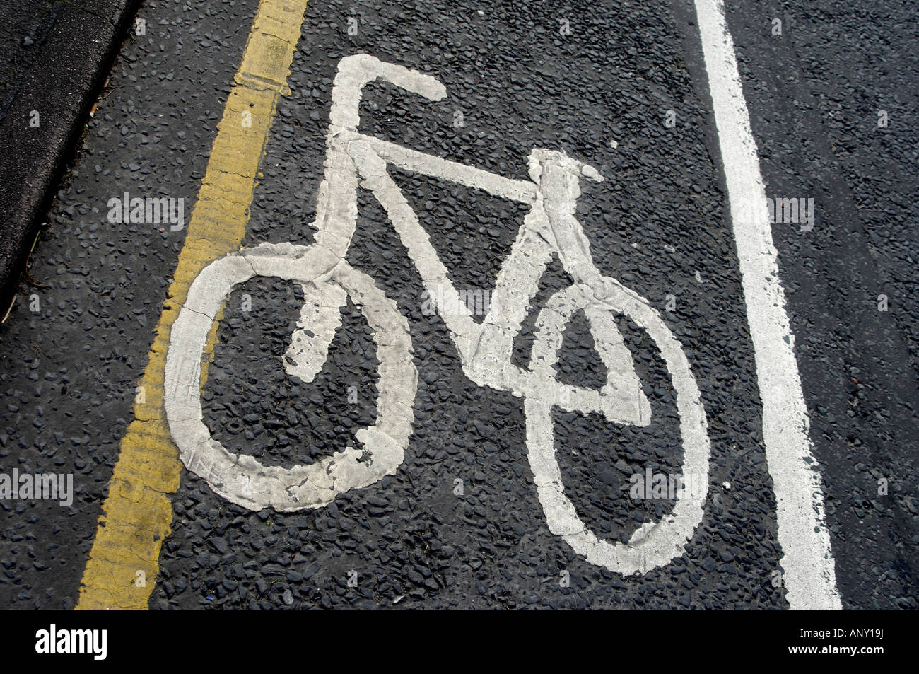 Painted cycle sign marking a cycle lane on a road in Britain Stock ...