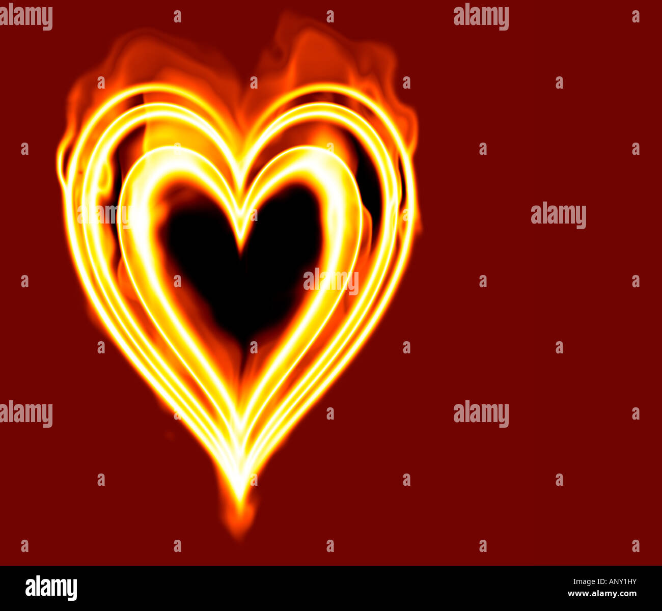 love heart burning in flames on red Stock Photo - Alamy
