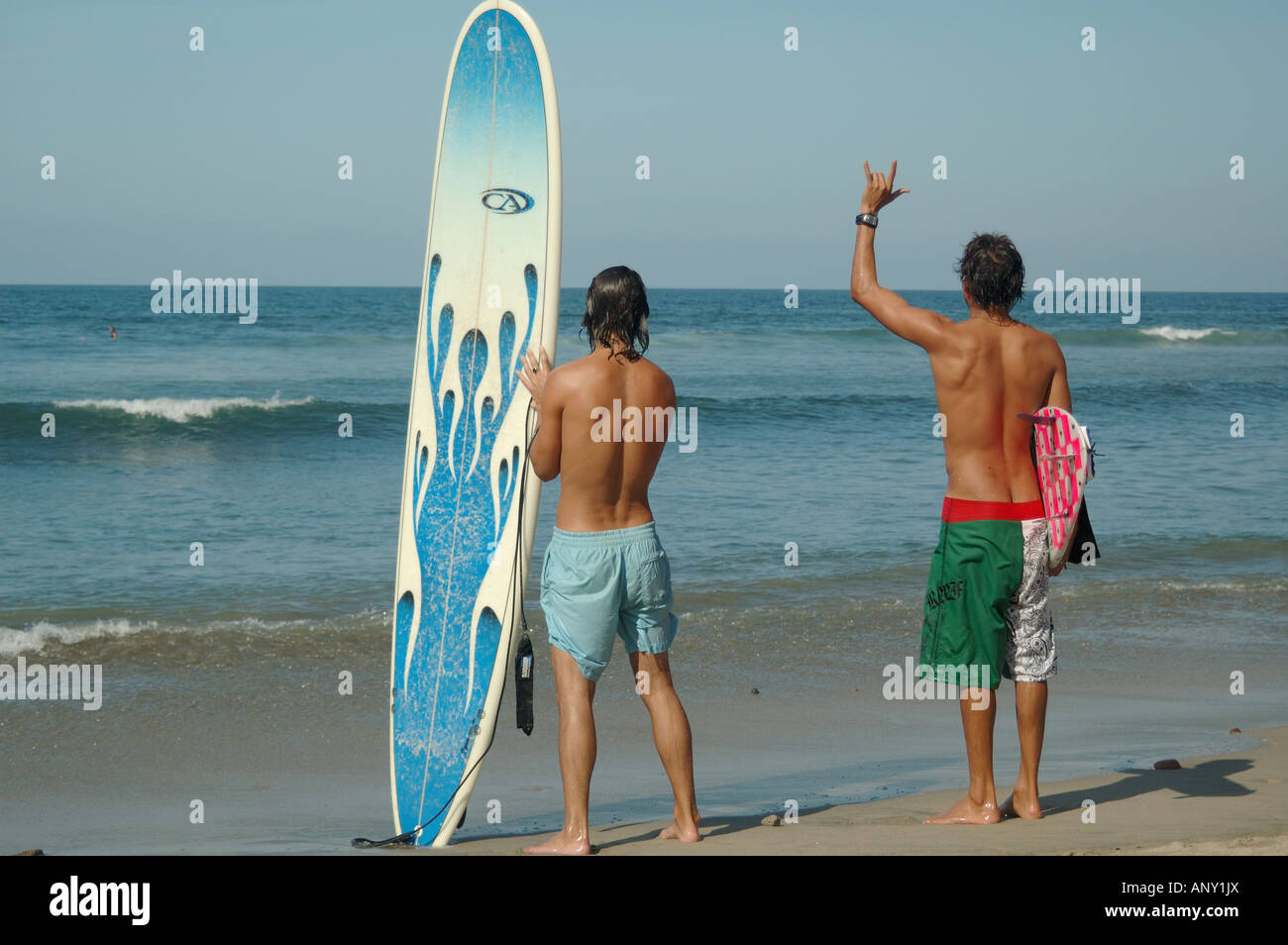 Two guys surfing surfboards Mexico ocean Stock Photo - Alamy