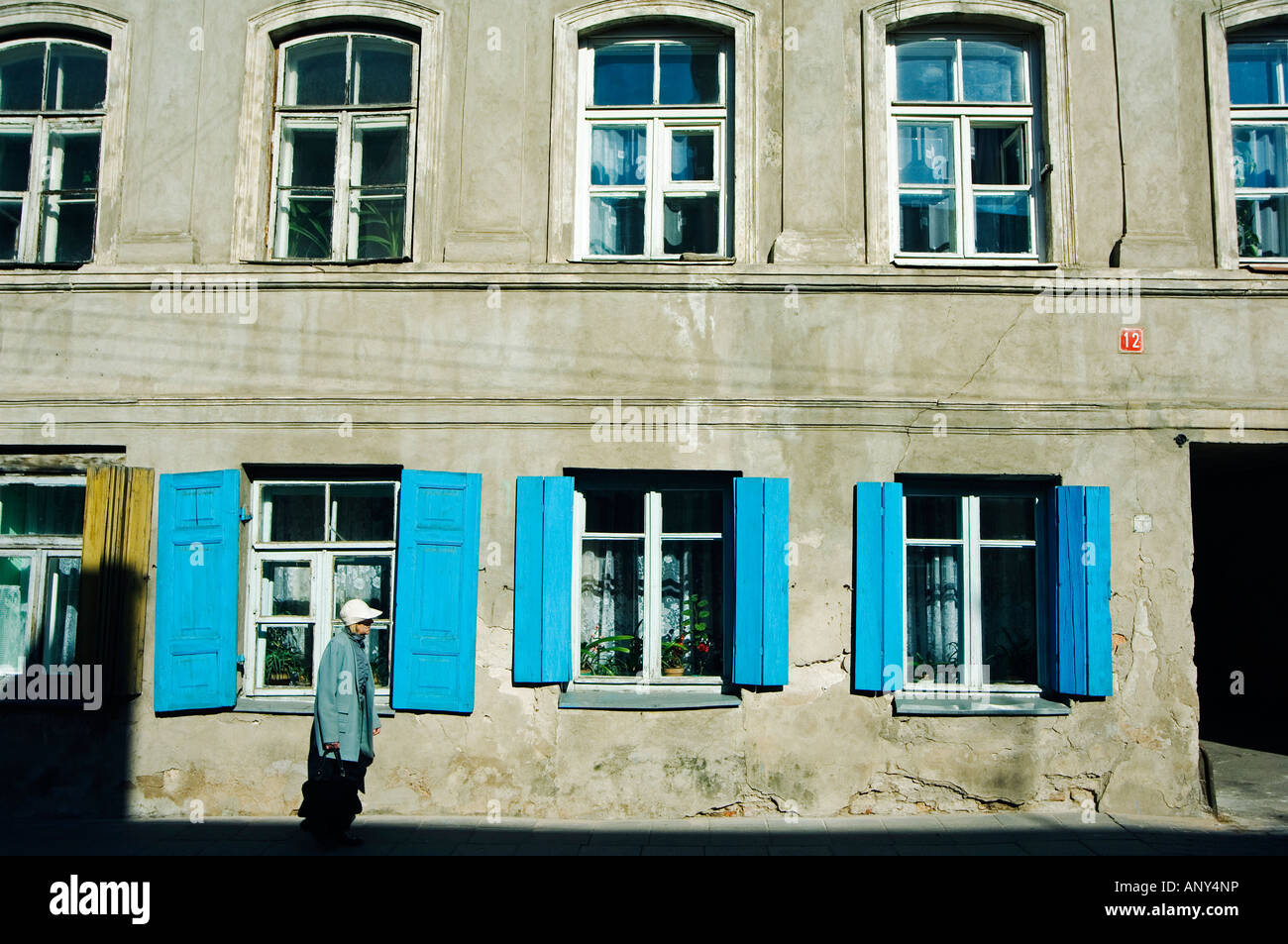 Lithuania, Vilnius. Colourful windows of an old town building - part of ...