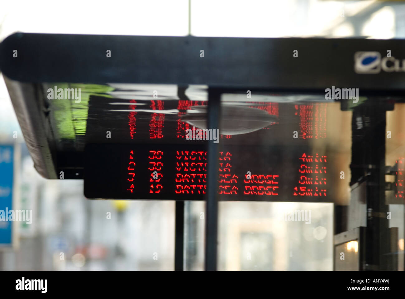roof of a bus stop with red notice of the next bus london Stock Photo ...