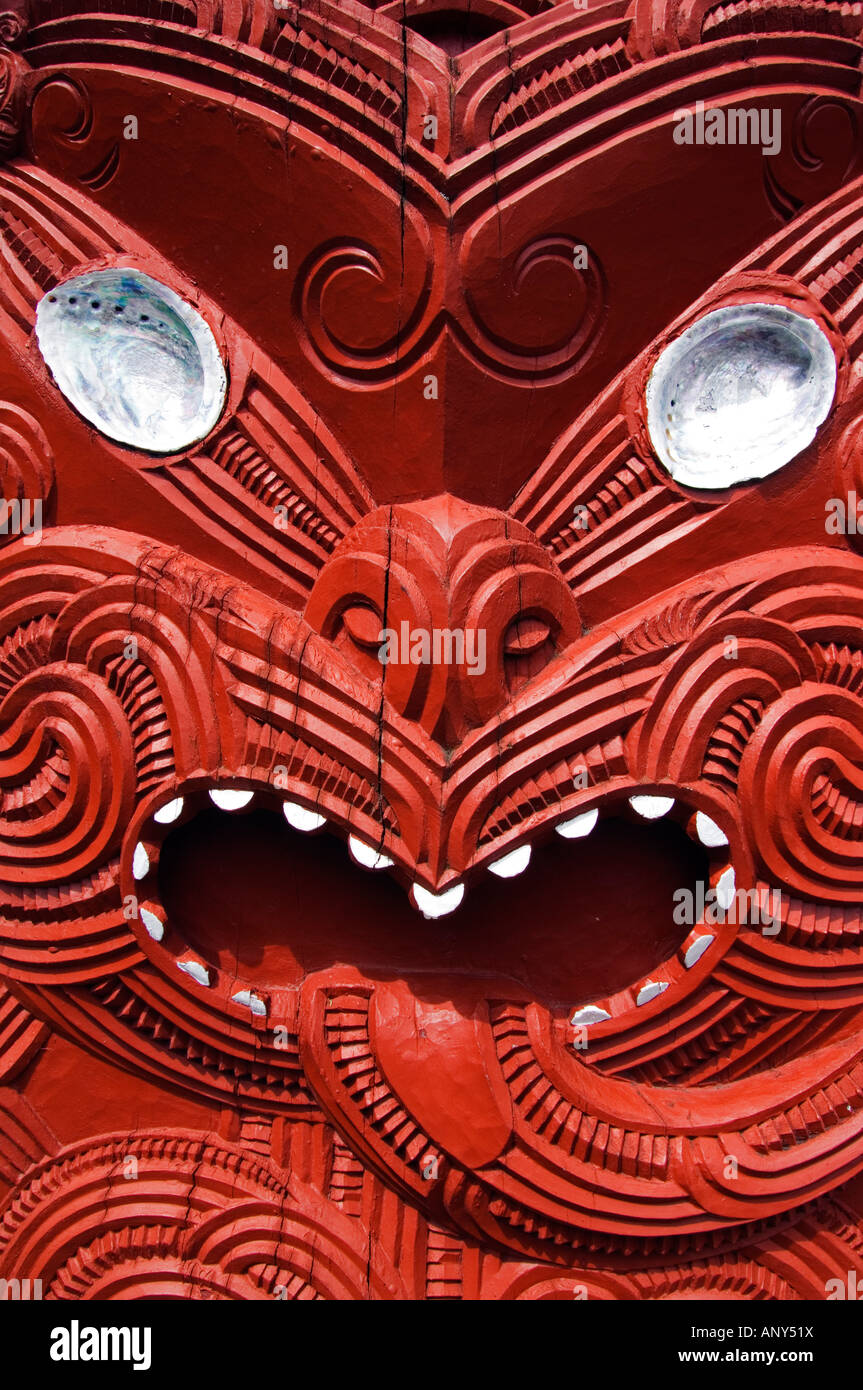 New Zealand, North Island, Rotorua. Carvings on a Whare Whakairo ...