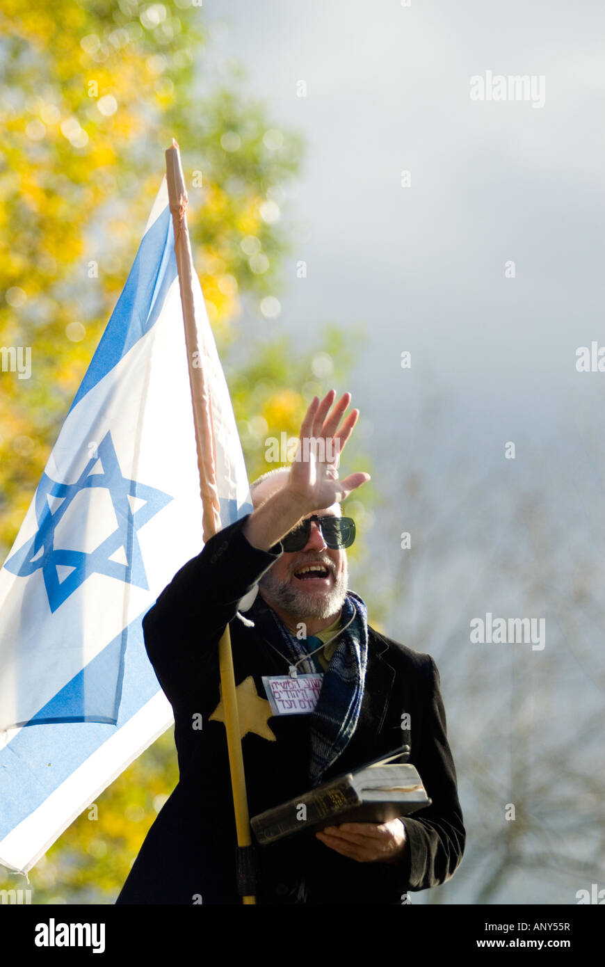 Jewish man with Israeli flag reading at speakers corner London Stock ...
