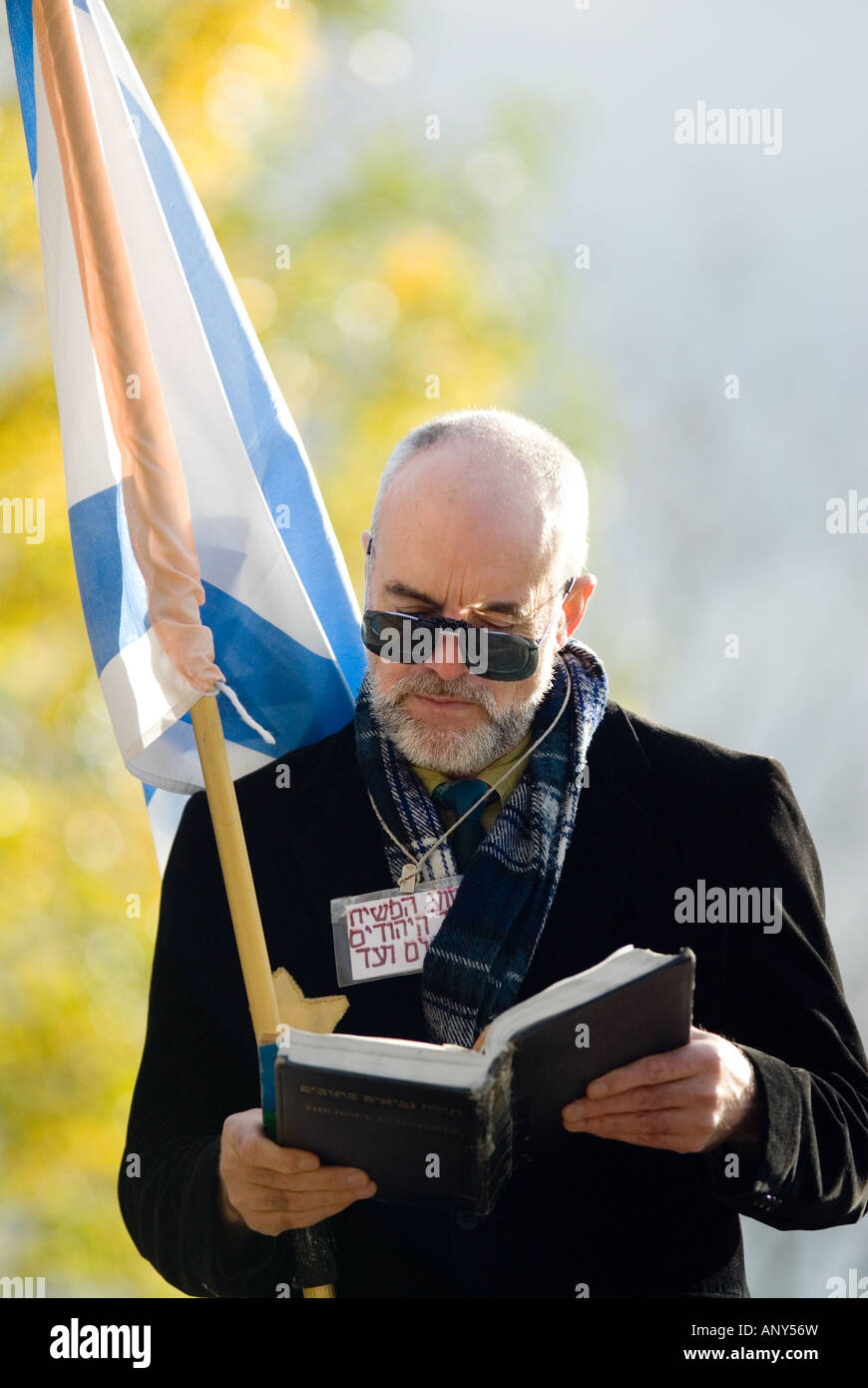 Jewish man with Israeli flag reading at speakers corner London Stock ...