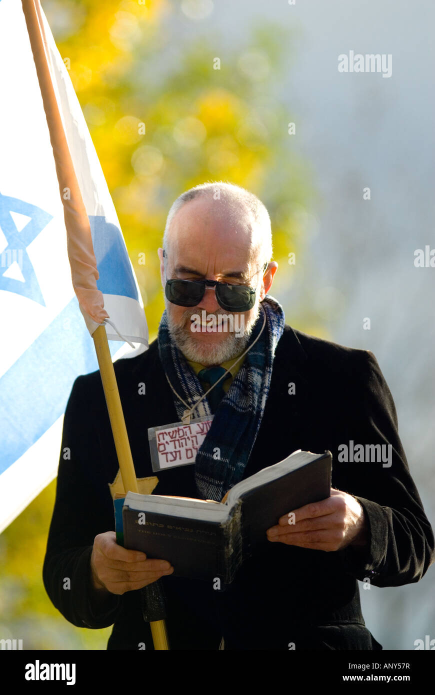 Jewish man with Israeli flag reading at speakers corner London Stock ...