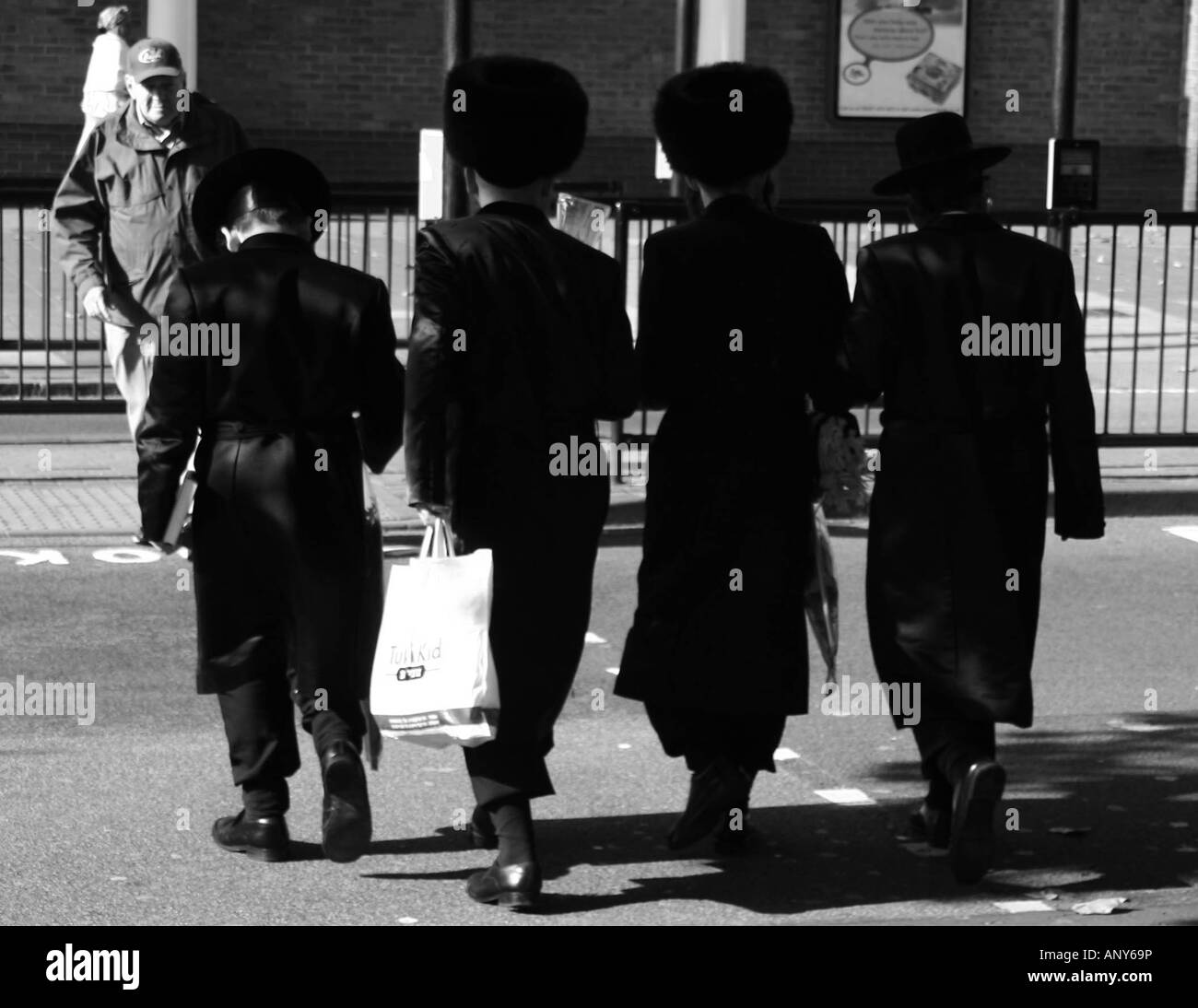 Back view of 4 Authodox Jews, Hasides walking on street Hasides, wierd ...
