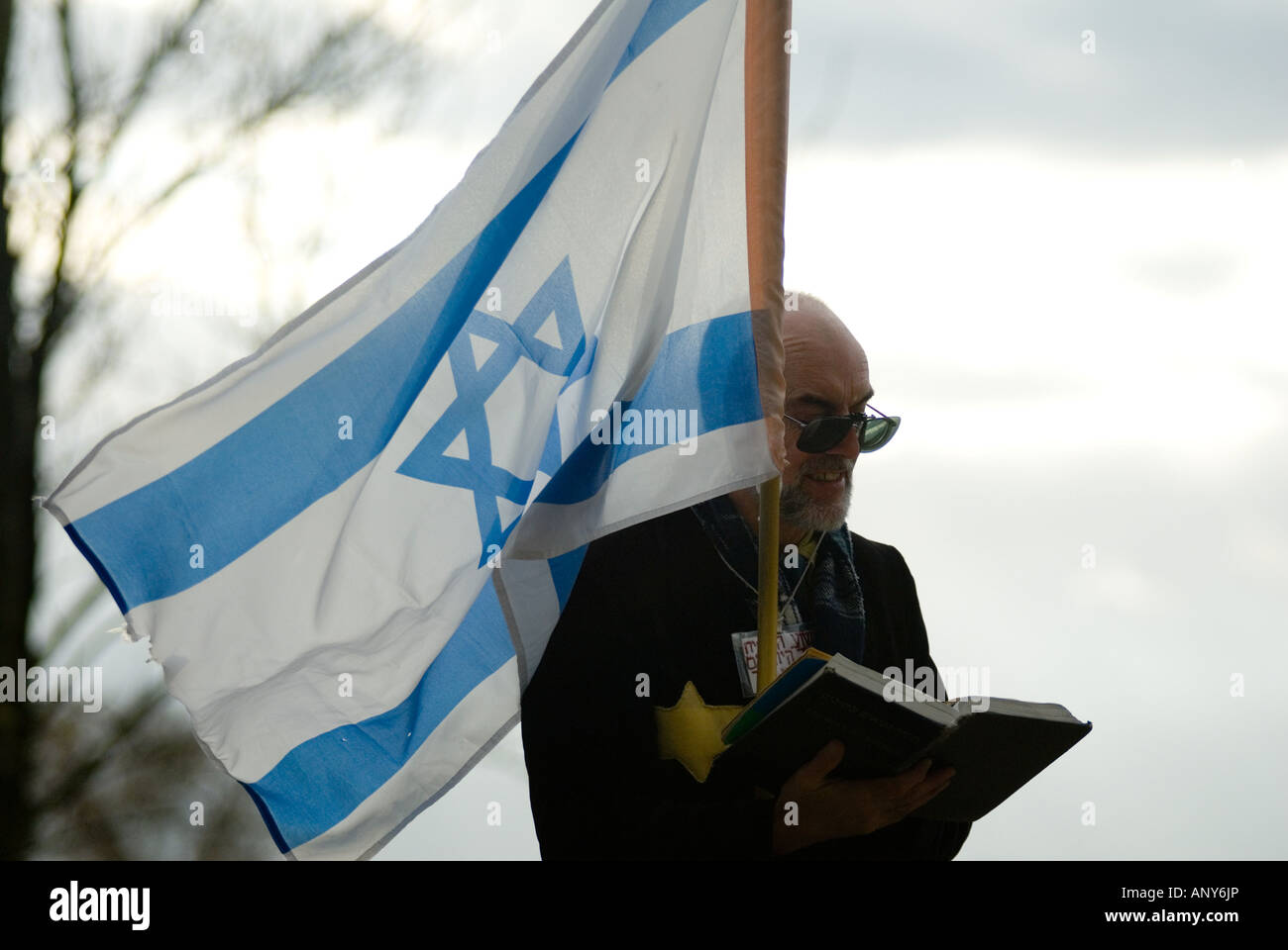 Jewish man with Israeli flag reading at speakers corner London Stock ...
