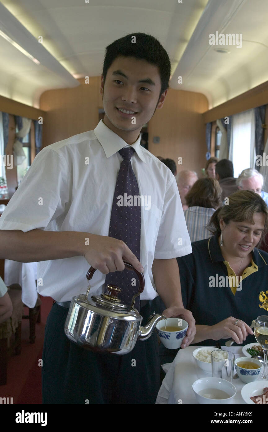 Tourists eating in the dining car of the Shangri La Express train China ...