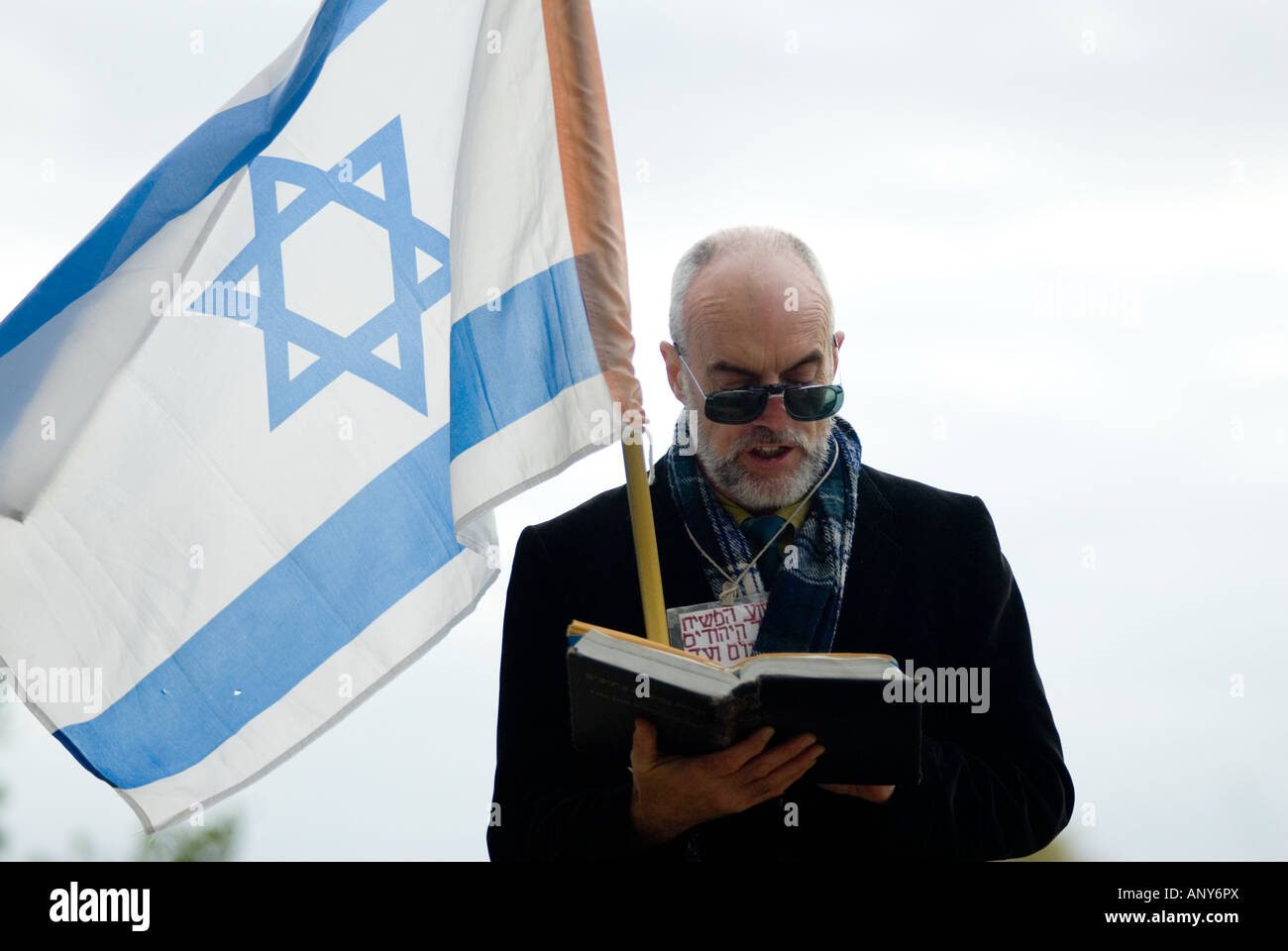 Jewish man with Israeli flag reading at speakers corner London Stock ...