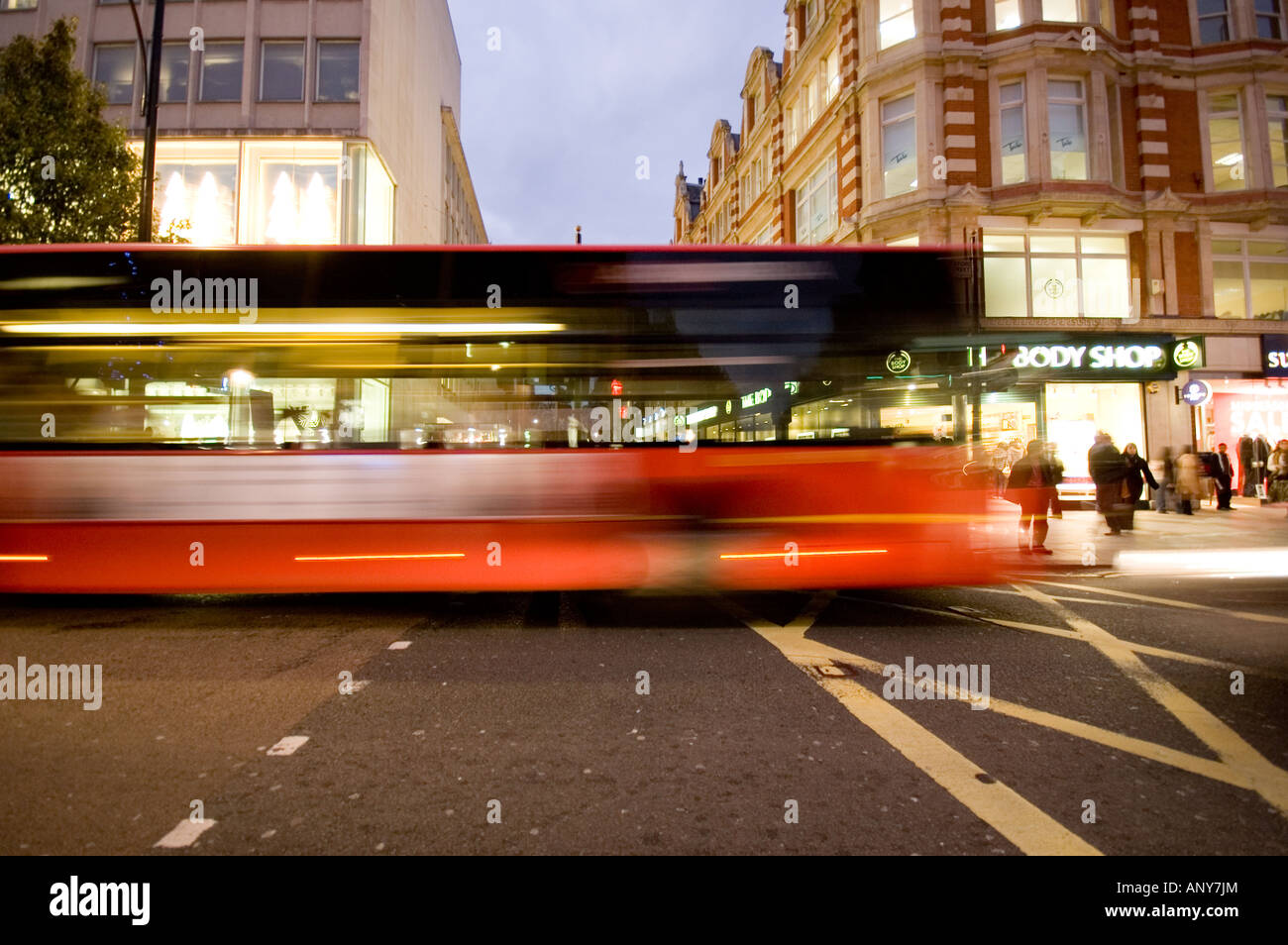 red bus pass through oxford street london Stock Photo - Alamy