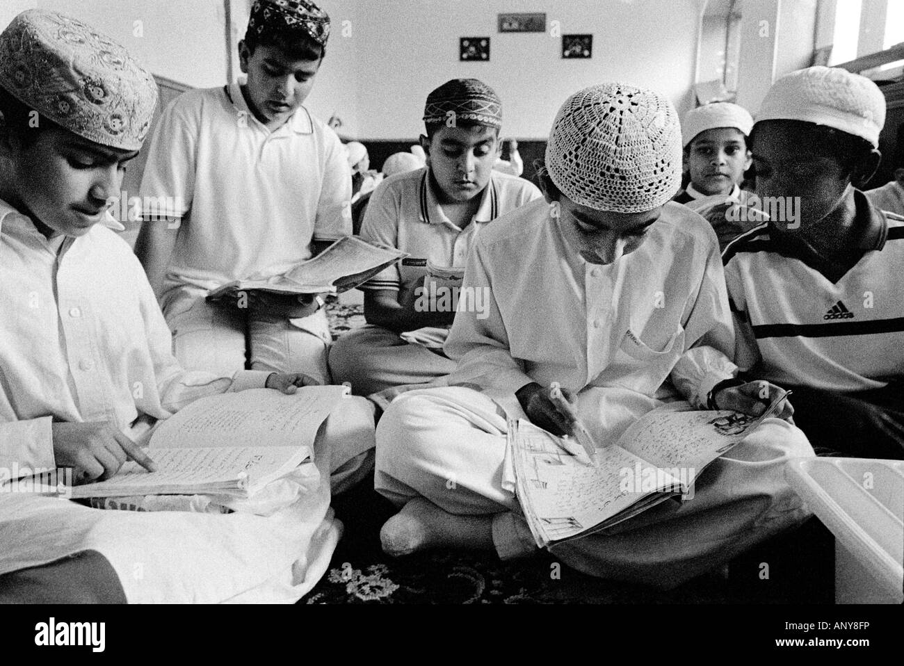 Children studying the Koran. Victor Street Mosque, Manningham, Bradford ...