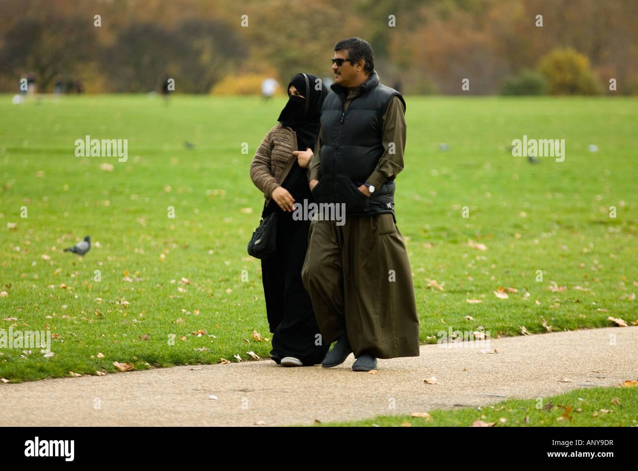 muslim couple walk in hide park London Stock Photo - Alamy