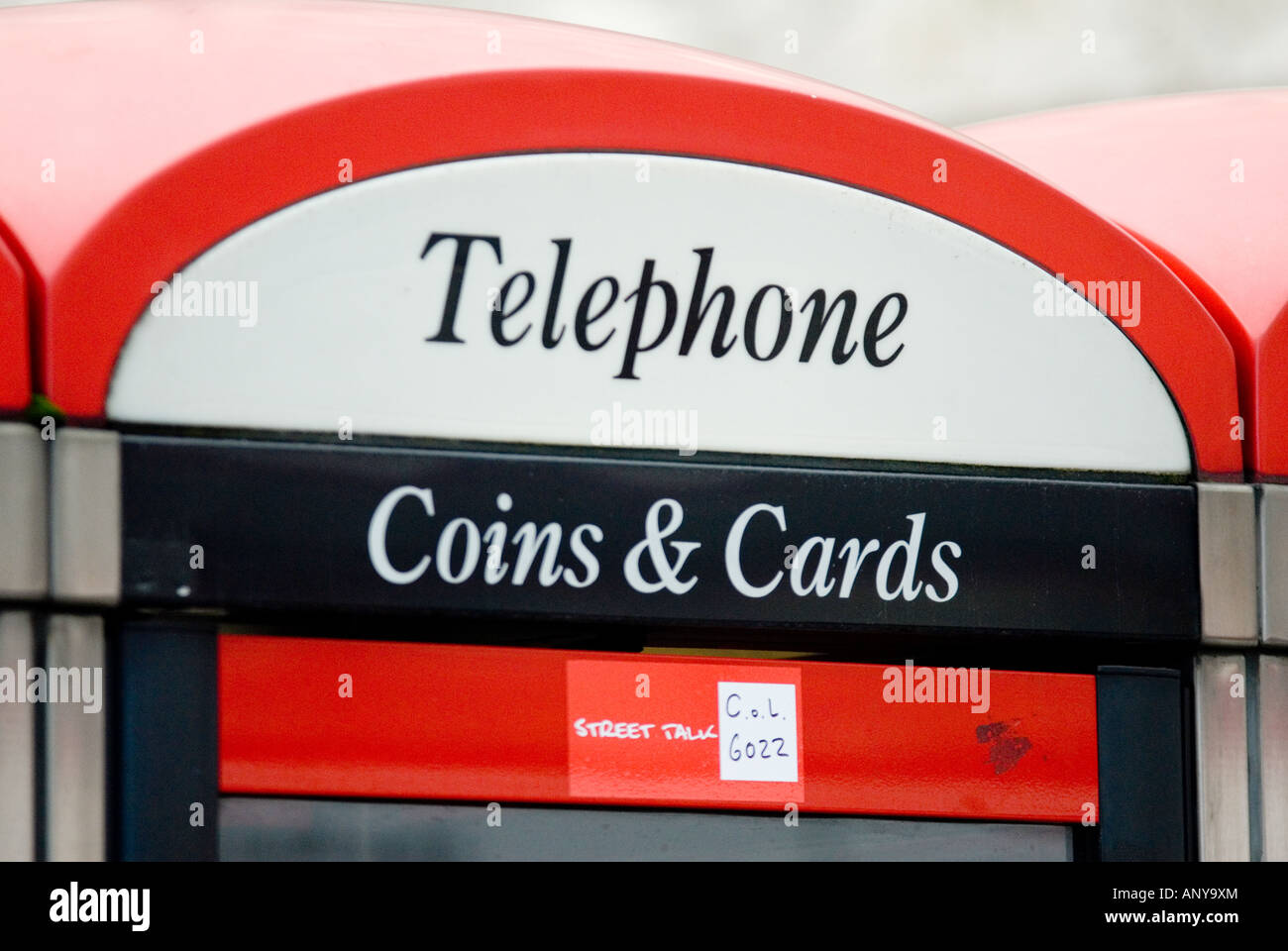 Red telephone box coins and cards in London Stock Photo - Alamy