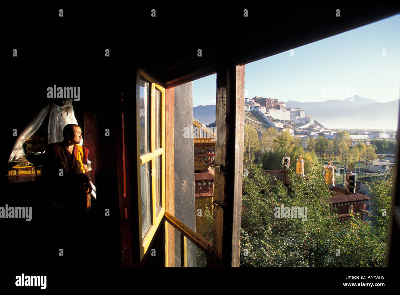 Tibet, Lhasa, Monk looking at the Potala Stock Photo - Alamy
