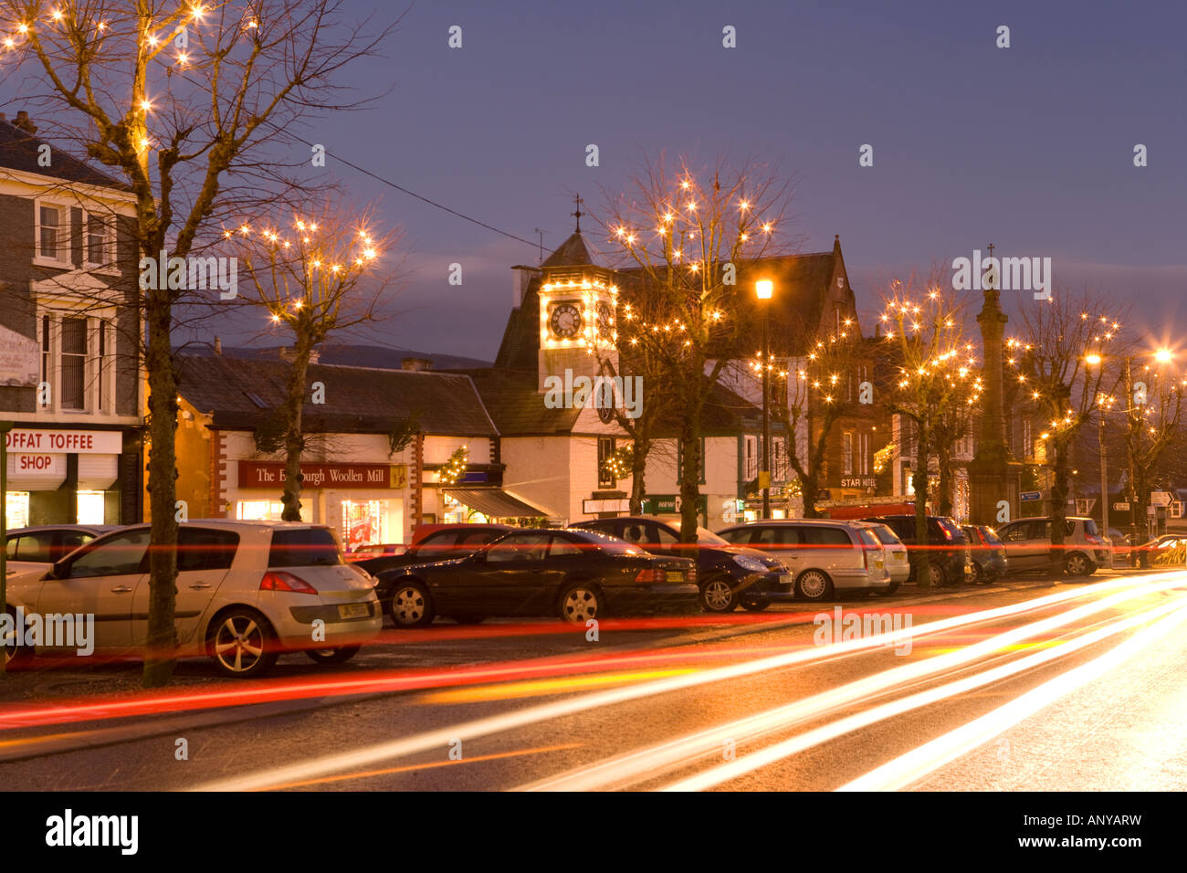 Dusk Christmas lights on the trees on the High Street Moffat with the ...