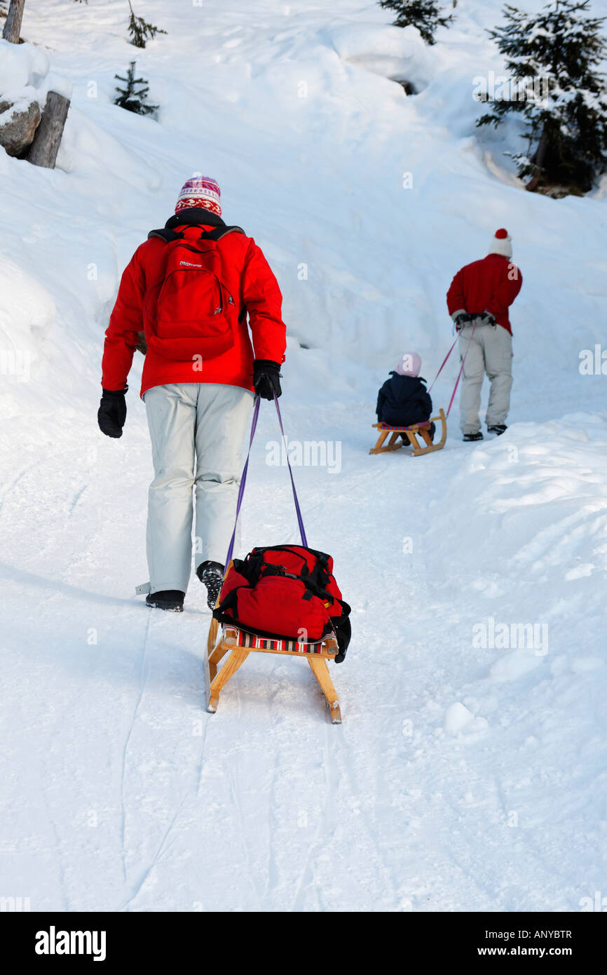 Going uphill for sledging Stock Photo - Alamy